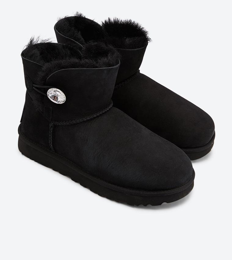 Buy Ugg Mini Bailey Button Bling Round Toe Boots Black In Black | 6thStreet Saudi Arabia