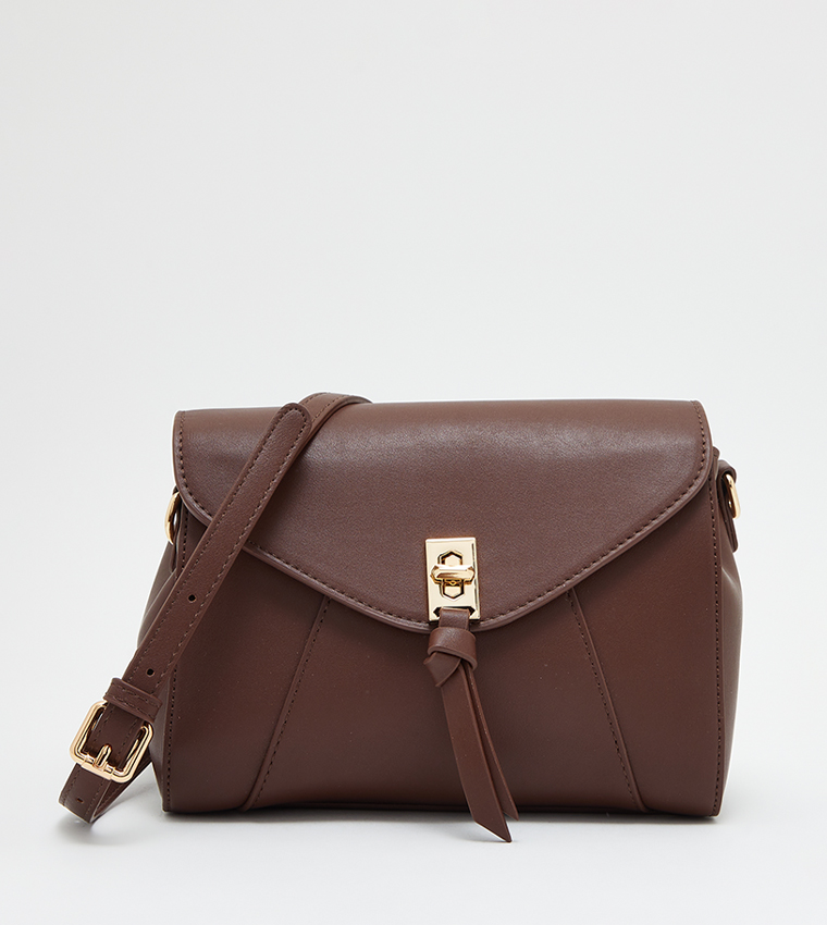 Buy Tyra Solid Twist Lock Crossbody Bag In Brown | 6thStreet Saudi Arabia
