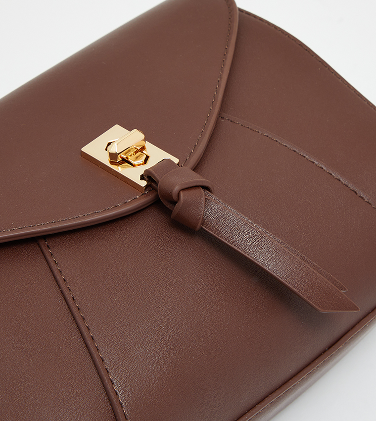 Buy Tyra Solid Twist Lock Crossbody Bag In Brown | 6thStreet UAE