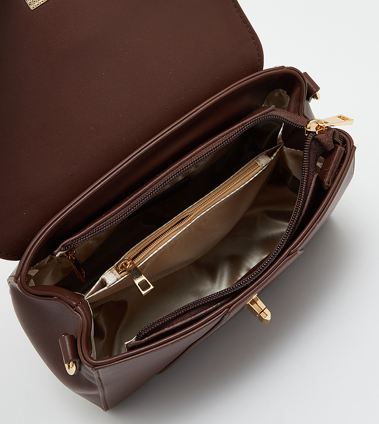 Buy Tyra Solid Twist Lock Crossbody Bag In Brown | 6thStreet UAE