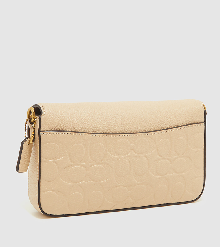 Buy COACH Textured Wyn Crossbody Bag In Beige | 6thStreet Kuwait