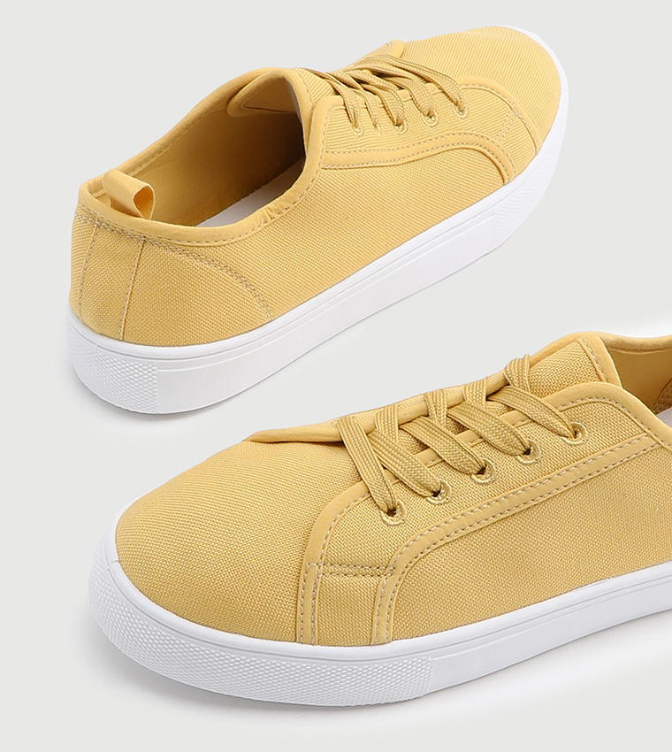 Buy Ardene Eco Conscious Laced Sneakers In Yellow | 6thStreet Qatar