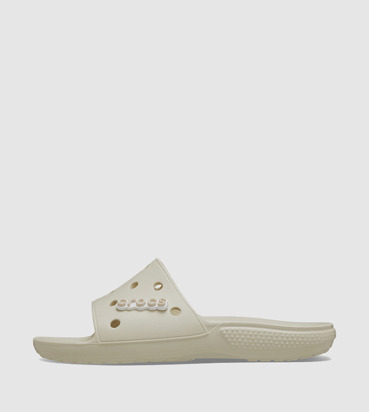 Buy Crocs Classic Crocs Slides In Beige | 6thStreet UAE
