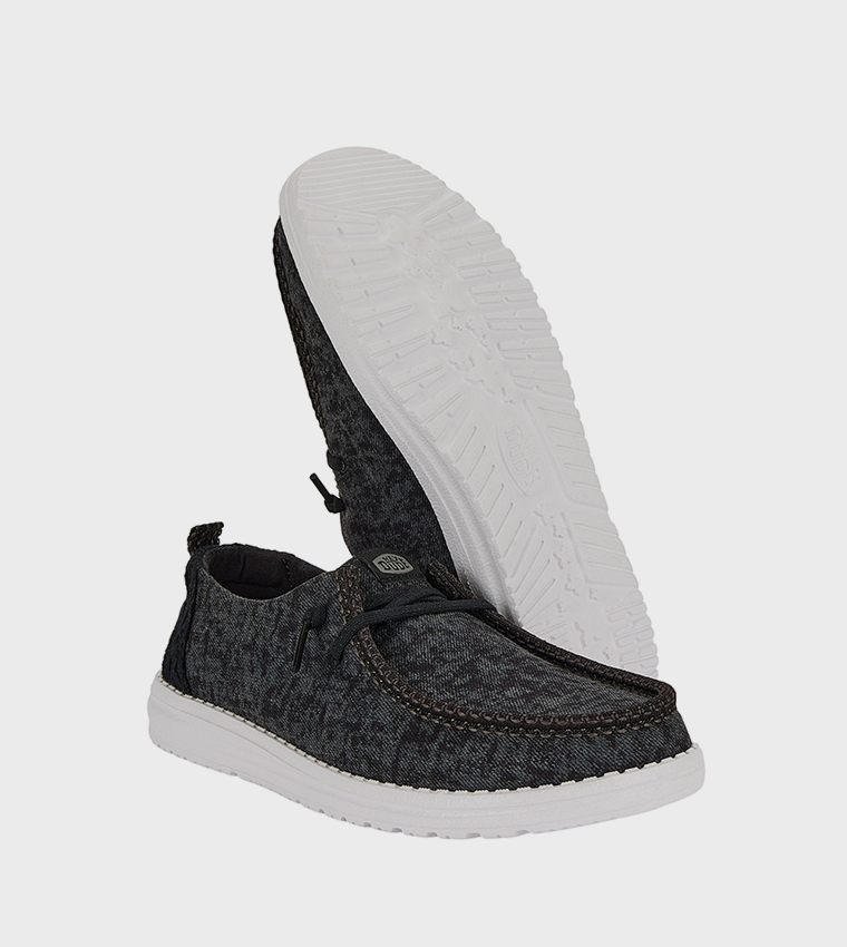 Buy HEY DUDE WENDY Textured Canvas Slip On Shoes In Black | 6thStreet Oman