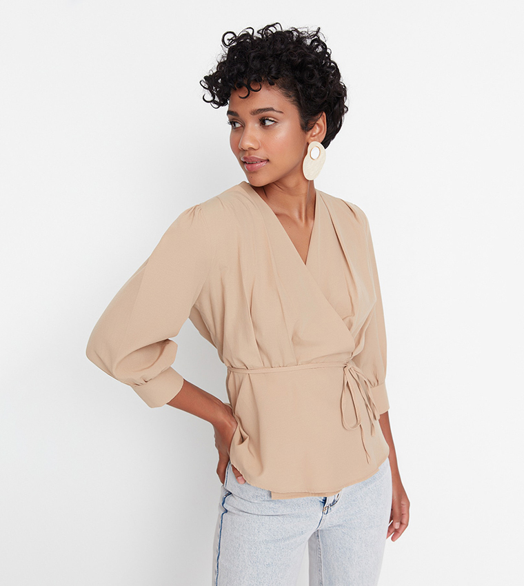 Buy Trendyol Cross Over Tie Up Peplum Top In Beige | 6thStreet UAE