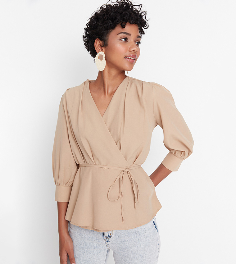 Buy Trendyol Cross Over Tie Up Peplum Top In Beige | 6thStreet UAE