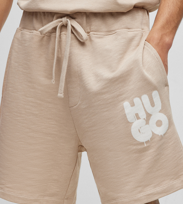 Buy HUGO Graffiti Style Stacked Logo Shorts In Beige | 6thStreet UAE