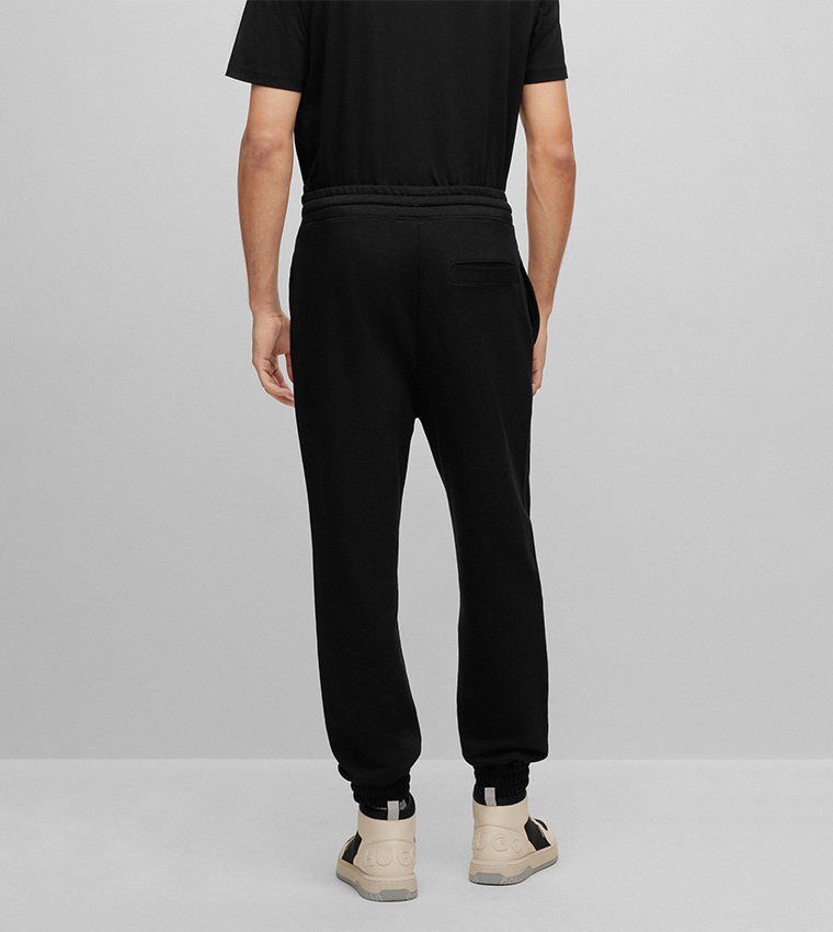 Buy Hugo Graffiti Style Logo Tracksuit Bottoms In Black | 6thStreet Qatar
