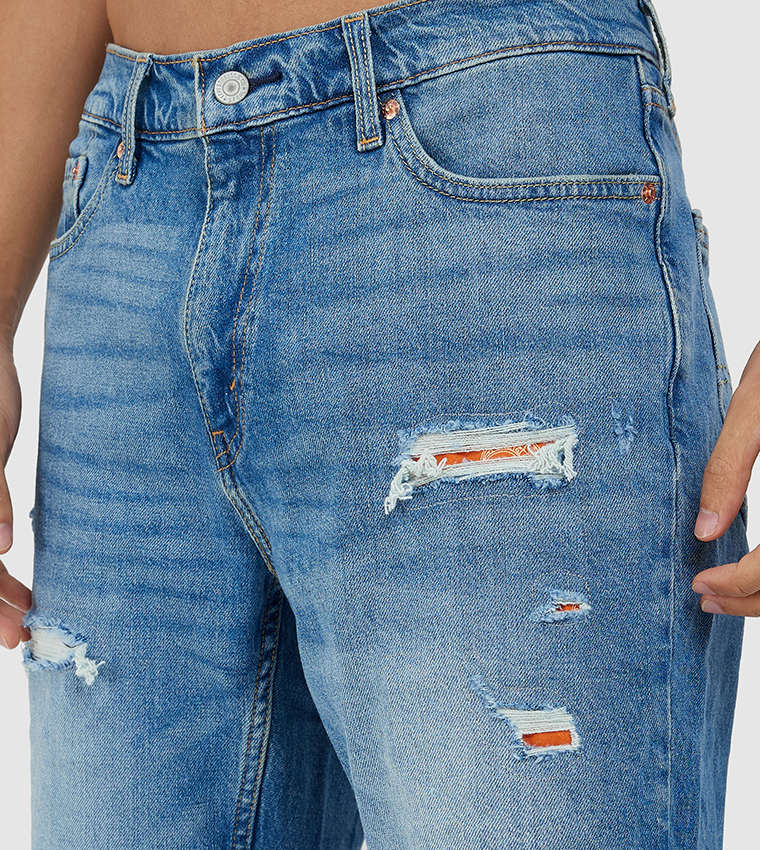 Buy Levi's Ripped Tapered Fit Denim Shorts In Blue | 6thStreet Qatar