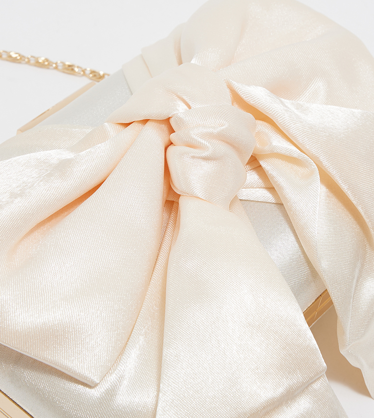 Buy Quazi @ CCC Bow Detail Clutch With Sling In Beige | 6thStreet UAE