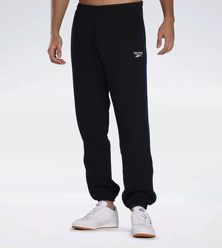 Buy Reebok Identity Logo Cuffed Track Pants In Black | 6thStreet Saudi ...