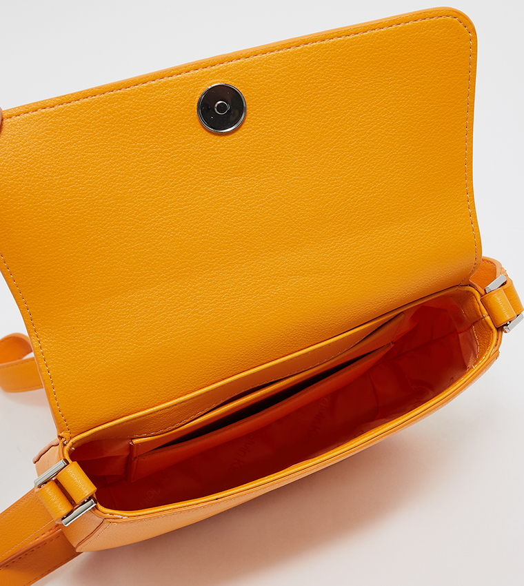 Buy Calvin Klein Saddle Crossbody Flap Closure Bag In Orange ...