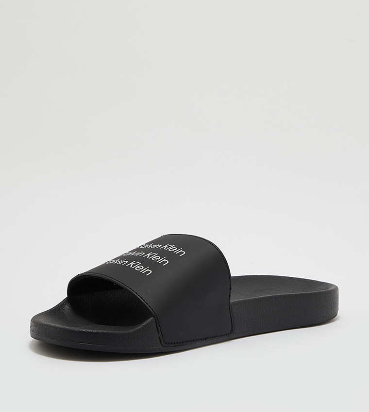 Buy Calvin Klein Open Toe PU Pool Slides In Black | 6thStreet UAE