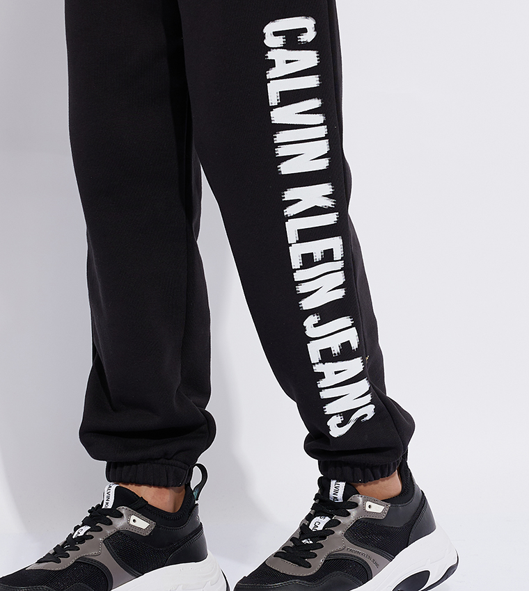Buy Calvin Klein Logo Printed Drawstring Waist Joggers In Black