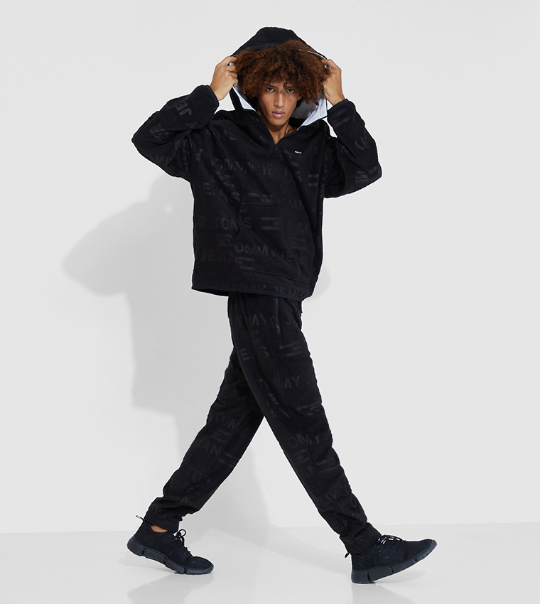 Buy Tommy Hilfiger Embossed Logo Relaxed Fit Joggers In Black ...