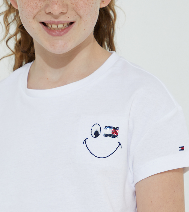 Buy Tommy Hilfiger Kids Smiley Face Logo Print T Shirt In White ...