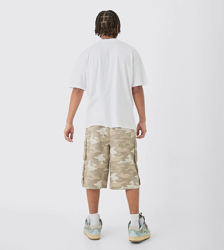 Buy BoohooMAN Skull Over Seams Graphic Print Oversized T Shirt In White ...