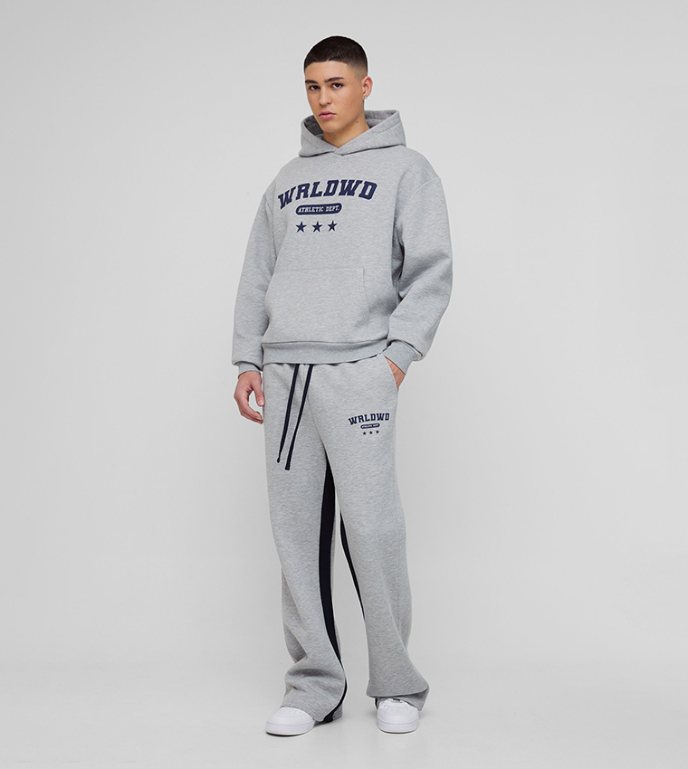 Buy BoohooMAN Worldwide Star Varsity Hooded Gus Oversized Co Ord Set In ...