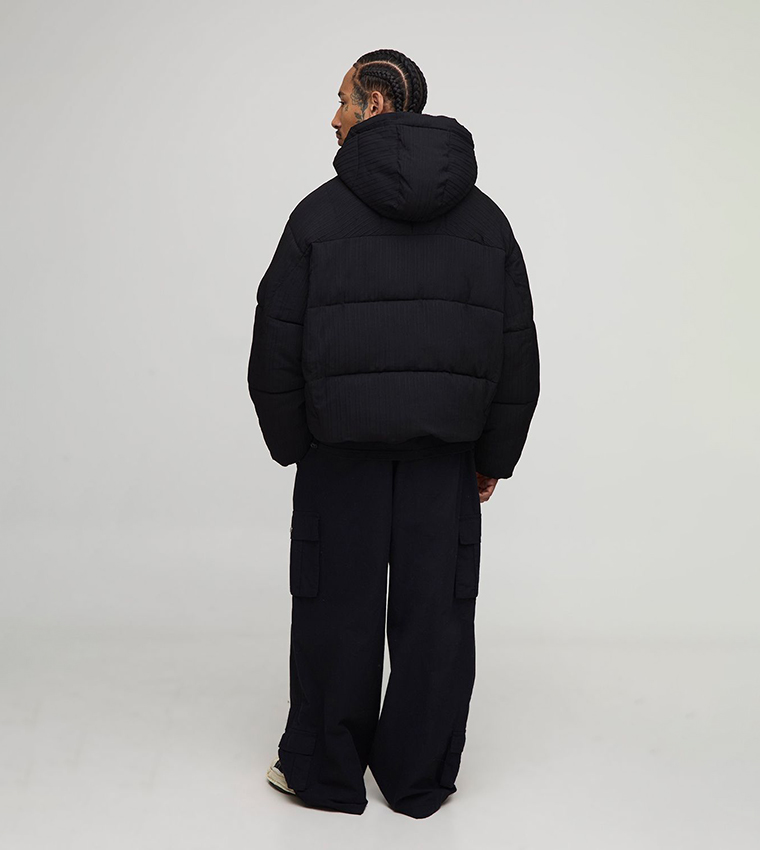 Buy BoohooMAN Regular Fit Textured Curved Panel Puffer Jacket In Black | 6thStreet UAE