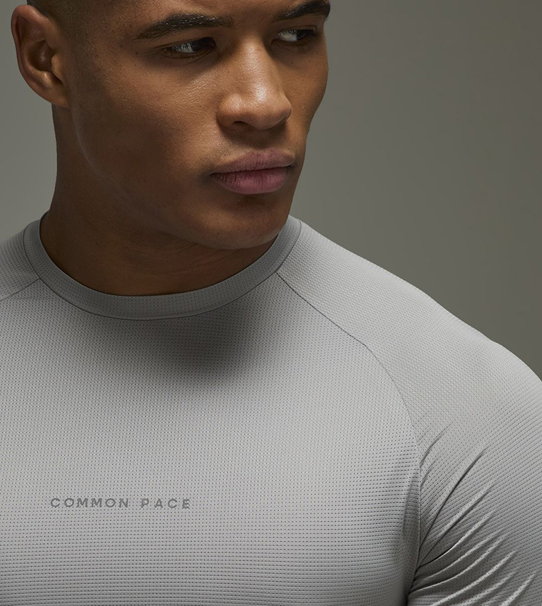 Buy BoohooMAN Common Pace Muscle Fit Mesh Running T Shirt In LIGHT GREY ...