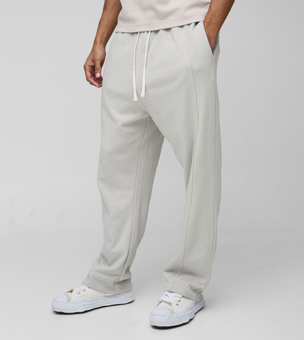 Buy BoohooMAN Outlet Loose Fit Drop Crotch Loopback Sweatpants In Grey ...