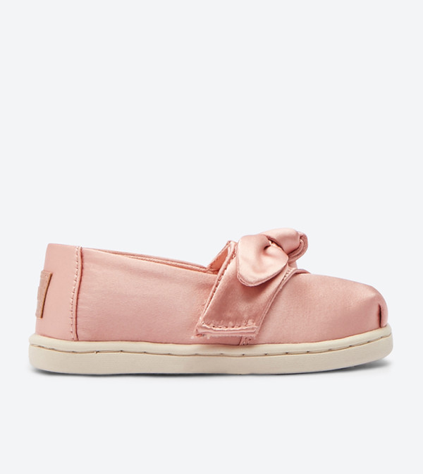 Buy Toms Tiny Bow Details Classics Slip Ons Pink In Pink | 6thStreet Qatar