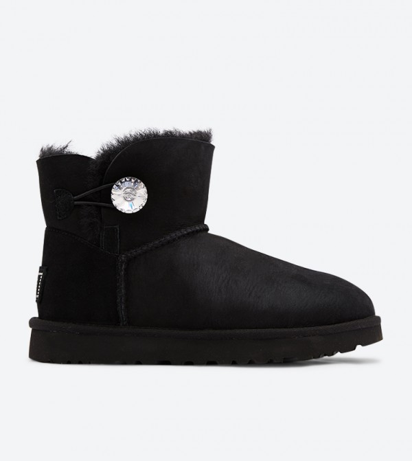 Buy Ugg Mini Bailey Button Bling Round Toe Boots Black In Black | 6thStreet Saudi Arabia
