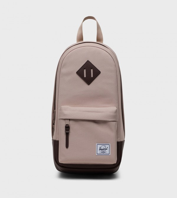 Buy Herschel Heritage™ Logo Badge Sling Bag In Cream | 6thStreet Bahrain