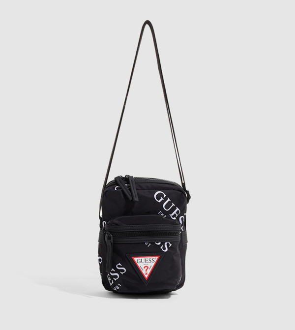 Buy Guess Logo Badge Detail Reporter Bag In Black | 6thStreet Saudi Arabia
