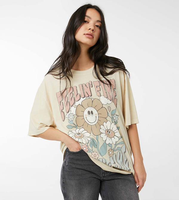 Buy Ardene Graphic Printed Oversized T Shirt In Beige | 6thStreet UAE