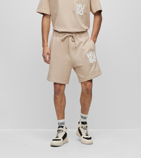 Buy HUGO Graffiti Style Stacked Logo Shorts In Beige | 6thStreet UAE