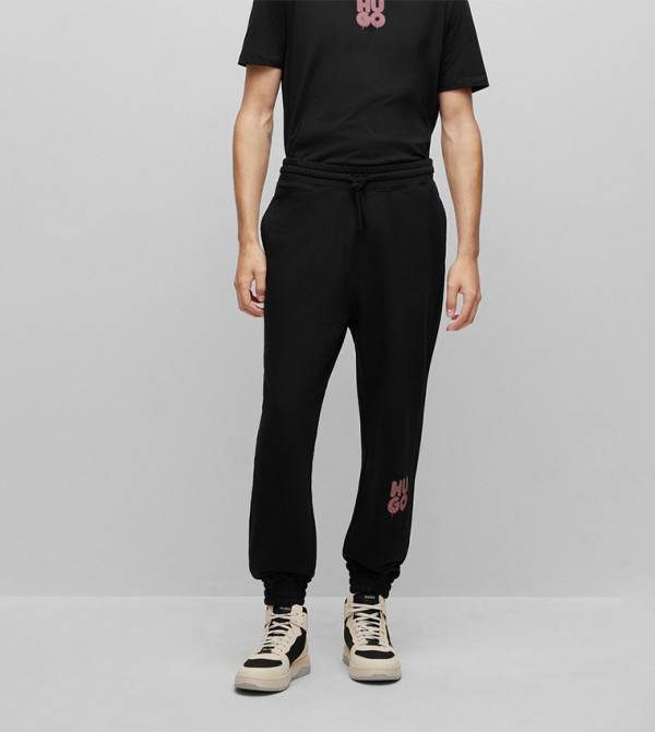 Buy Hugo Graffiti Style Logo Tracksuit Bottoms In Black | 6thStreet Qatar