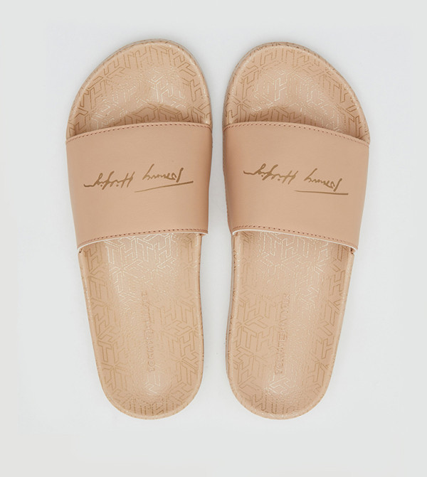 Buy Tommy Hilfiger Signature Logo Pool Slides In Beige | 6thStreet UAE