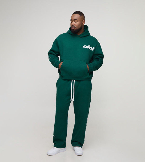 Buy BoohooMAN Ofcl Print Hoodie & Baggy Fit Sweatpant Tracksuit In ...