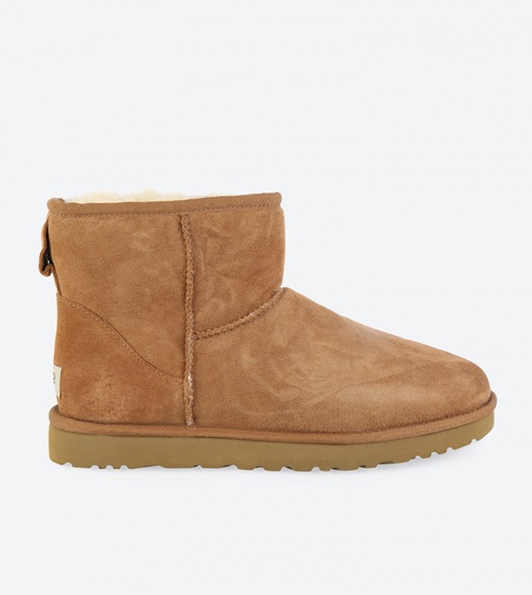 Buy Ugg Classic Mini Brown Boots In Brown | 6thStreet Qatar