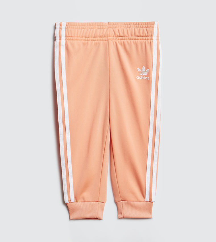 اشتري اديداس بدلة SST رياضية بلون وردي | 6ستريت المملكة العربية السعودية