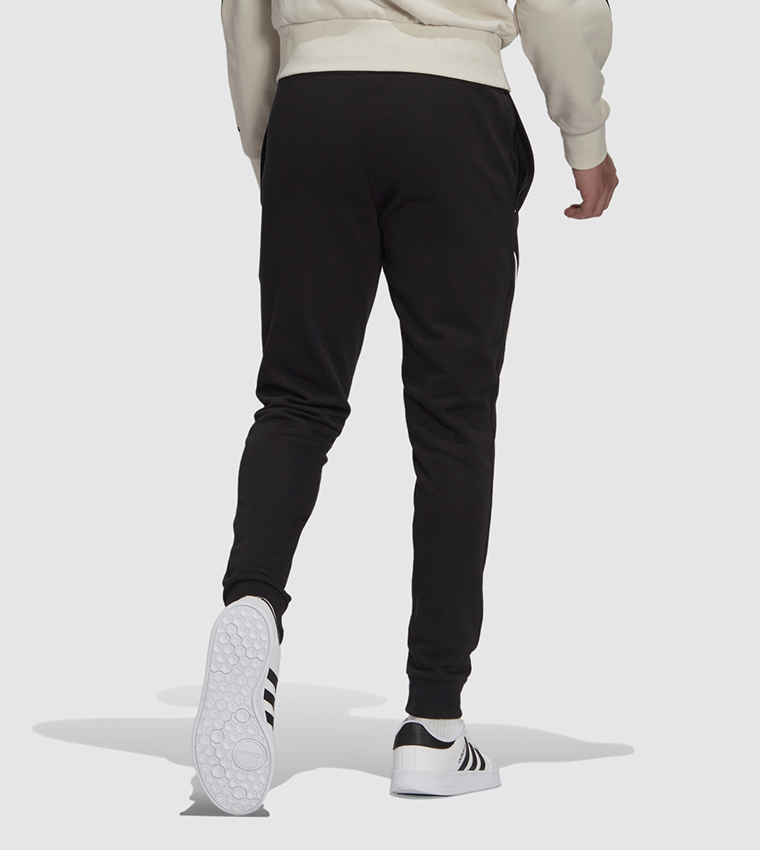 Buy Adidas Essentials Logo Pants In Black | 6thStreet Qatar