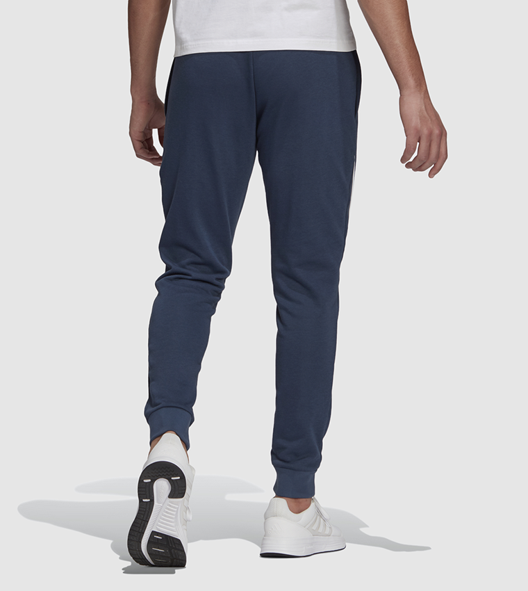 Buy Adidas Essentials Logo Pants In Blue | 6thstreet Qatar