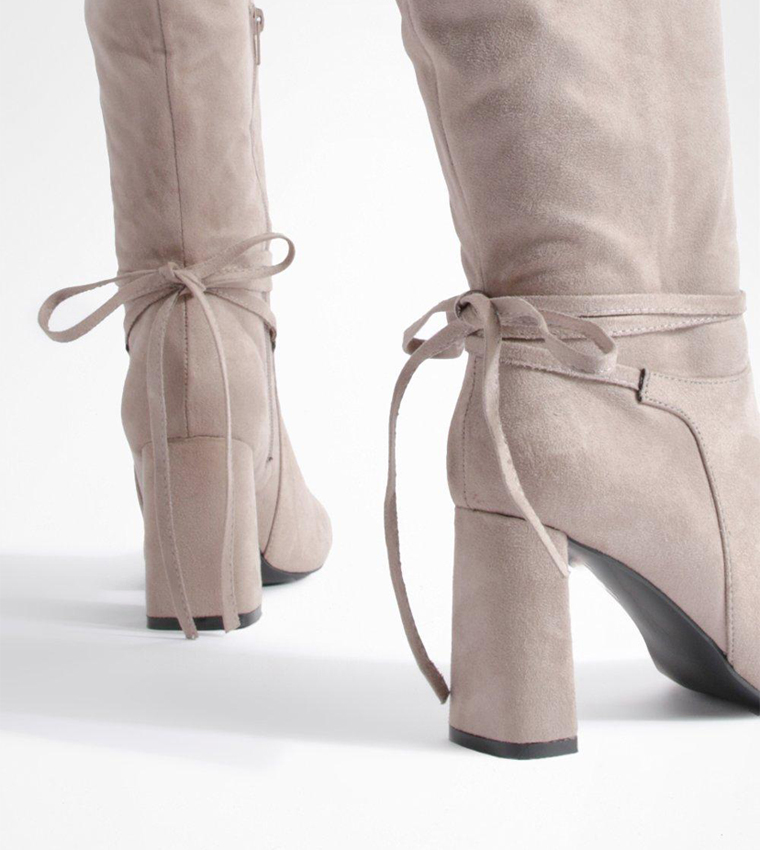 Buy Boohoo Wide Fit Block Heel Bow Detail Knee High Boots In Beige ...