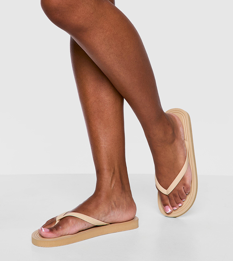 Buy Boohoo Outlet Wide Fit Round Toe Flip Flops In Nude | 6thStreet UAE
