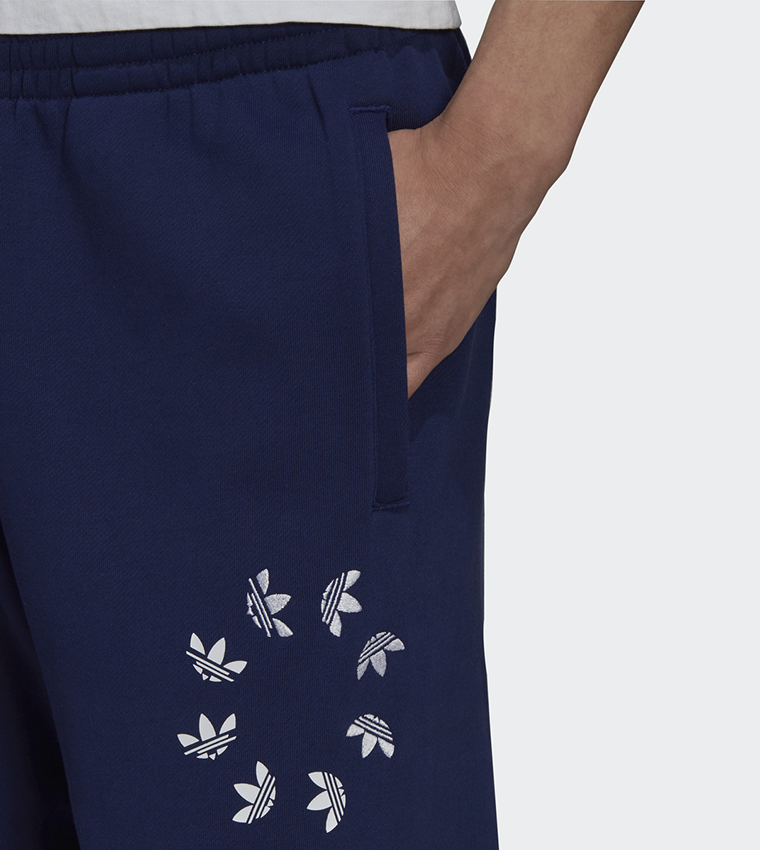 Buy Adidas Adicolor Shattered Trefoil Sweat Pants In Blue | 6thStreet Qatar