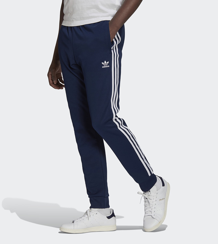 Buy Adidas Adicolor Classics Primeblue SST Tracksuit Bottoms In Blue ...