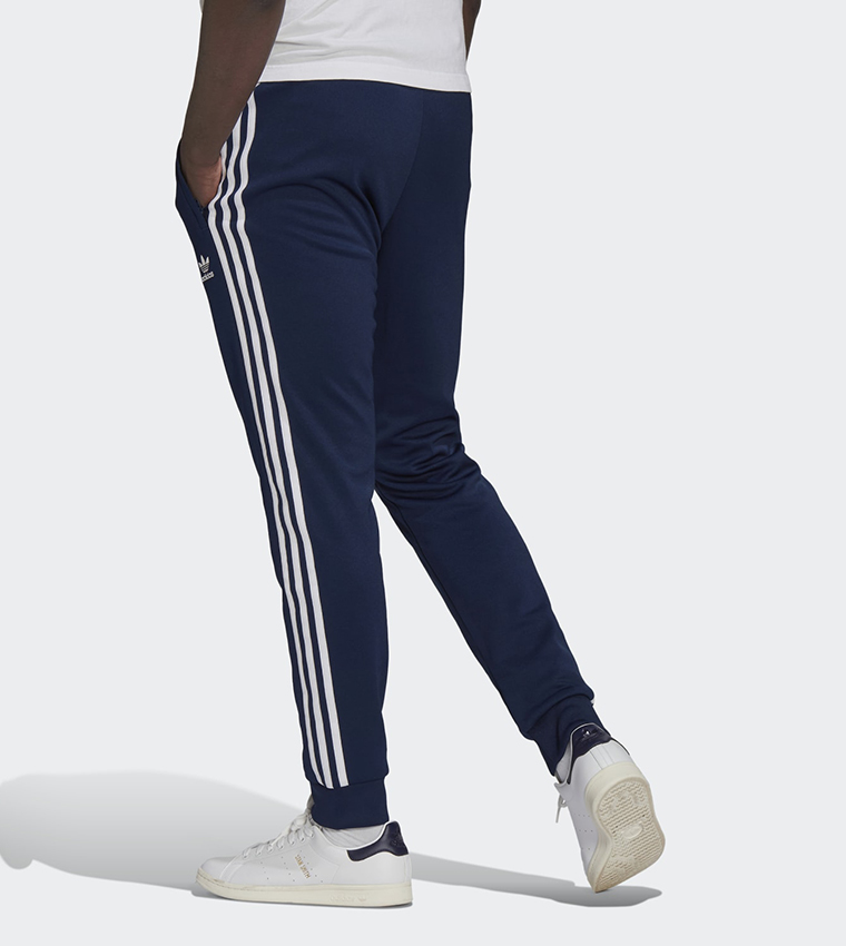 Buy Adidas Adicolor Classics Primeblue SST Tracksuit Bottoms In Blue ...