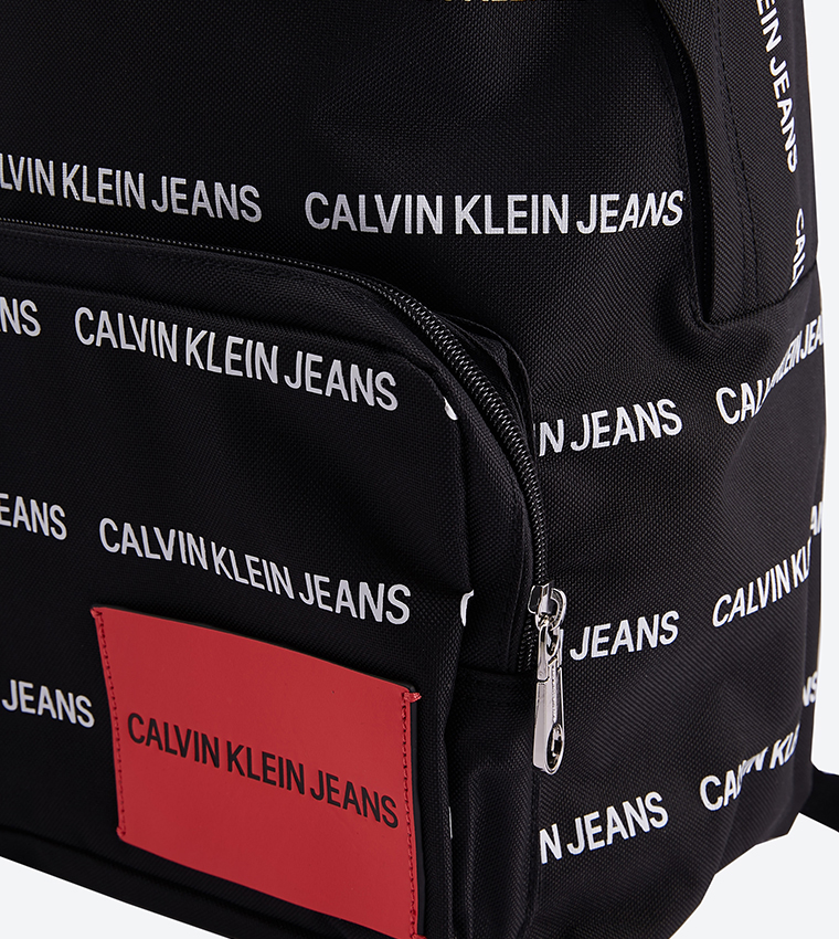 Buy Calvin Klein Top Hook Logo Marquee Printed Backpacks Black In Black ...