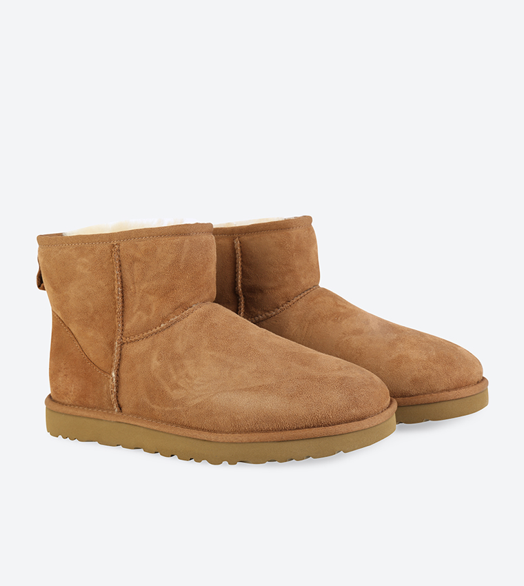 Buy Ugg Classic Mini Brown Boots In Brown | 6thStreet Qatar
