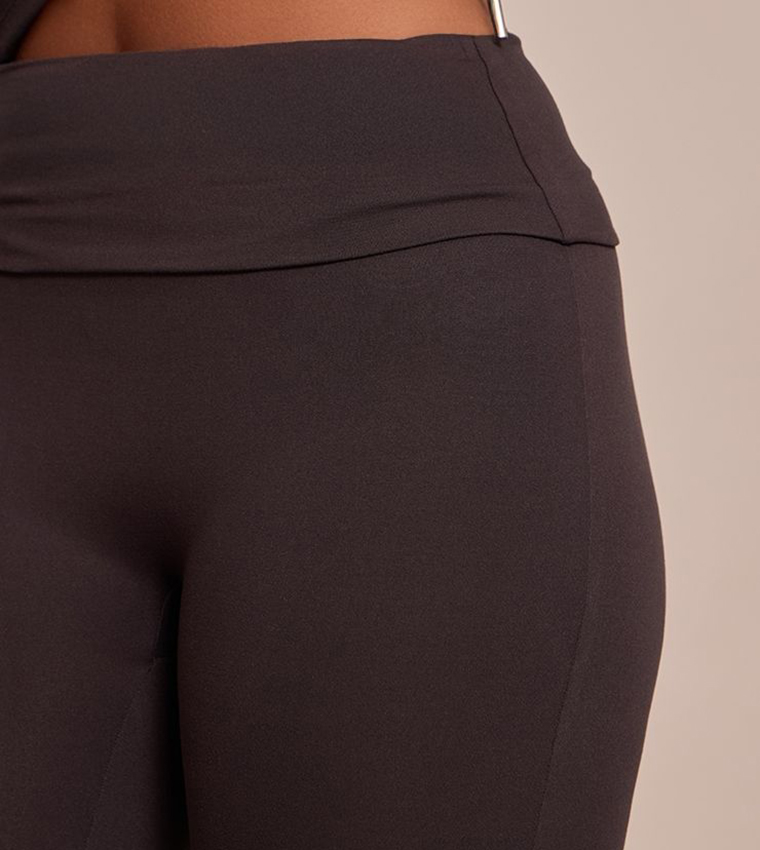 Buy PrettyLittleThing Shape Sculpted Fold Over Waist Flared Trousers In ...